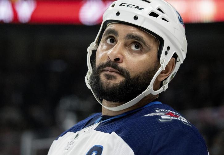 Jets suspend Dustin Byfuglien without pay as defenceman continues to ...