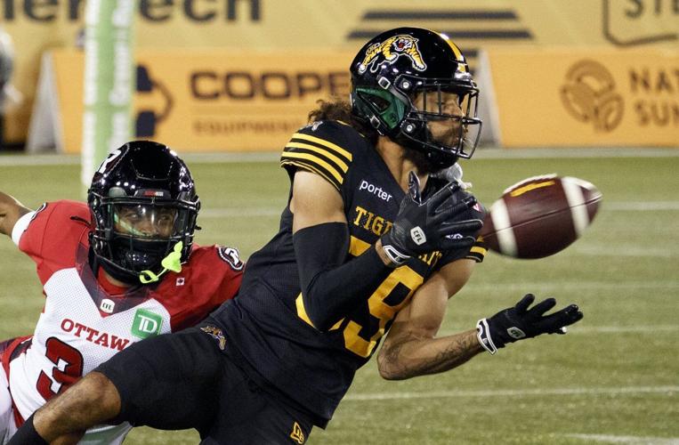 Mitchell throws two touchdown passes as Ticats down Redblacks to clinch ...