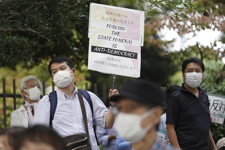 Abe’s militaristic funeral captures Japan’s tense mood