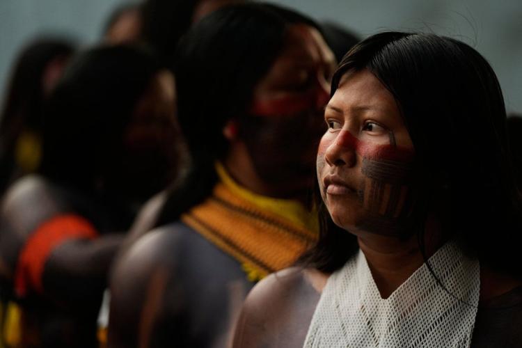 Photos show Indigenous participants at the People's Summit held ...
