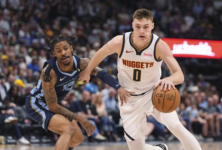 Jokic clinches triple-double average, Murray returns in the Nuggets' 117-109 win over the Grizzlies