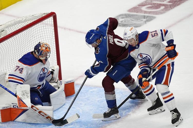 MacKinnon has 2 assists, breaks franchise's single-season points mark ...
