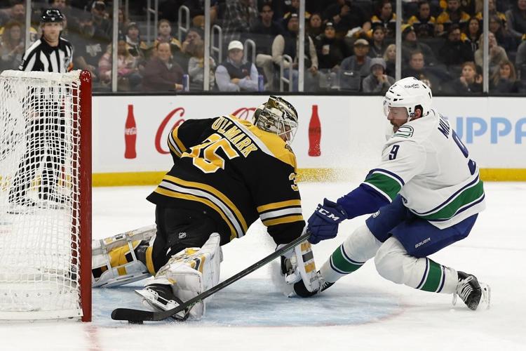 Bruins improve to team-record 9-0 at home, beat Canucks