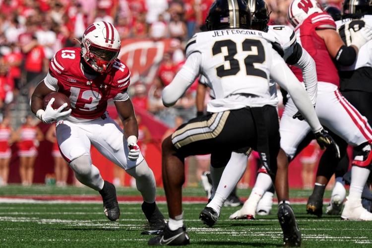 Locke throws for 359 yards and 3 TDs as Wisconsin steamrolls slumping ...