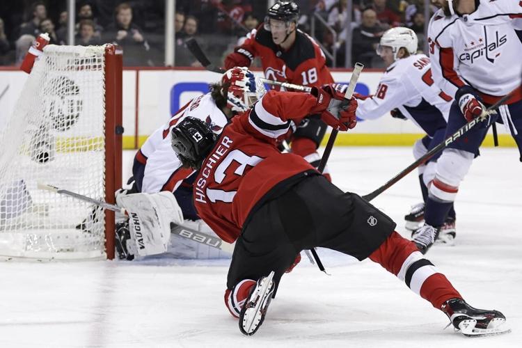 Capitals score three in third to rally for 6-4 win over Devils