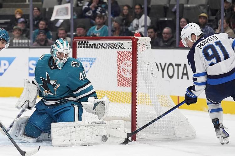 Lowry scores late goal to help Jets sink Sharks 4-3