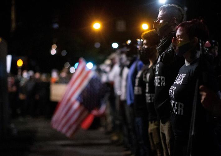 Portland protesters breach fence around federal courthouse