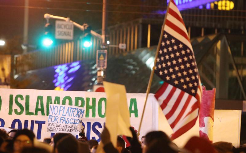 Twelve arrested, two police officers injured following protests at Munk ...