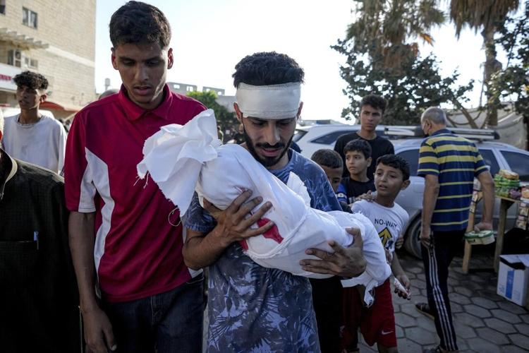 A Gaza father mourns his baby boy, killed in bed by an Israeli airstrike