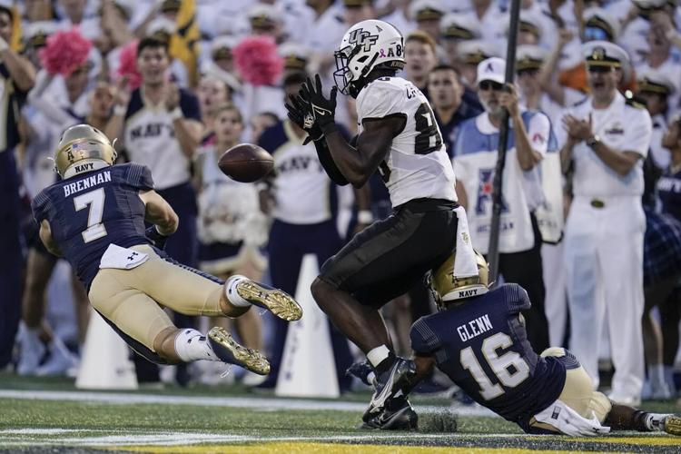 Navy scores 17 fourth-quarter points to overtake UCF 34-30