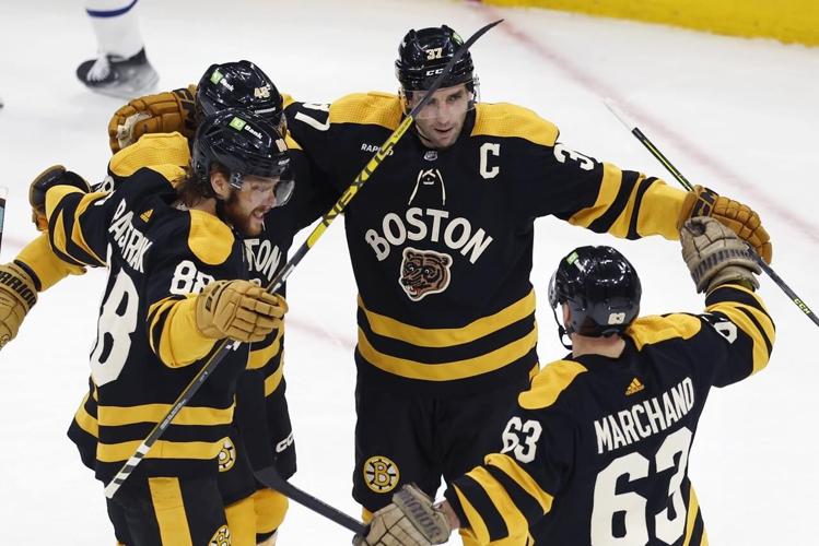 Grzelcyk breaks late tie, Bruins beat Maple Leafs 4-3