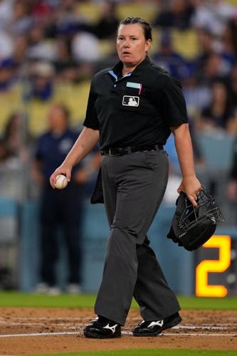 Shohei Ohtani greets Jen Pawol behind the plate at Dodgers