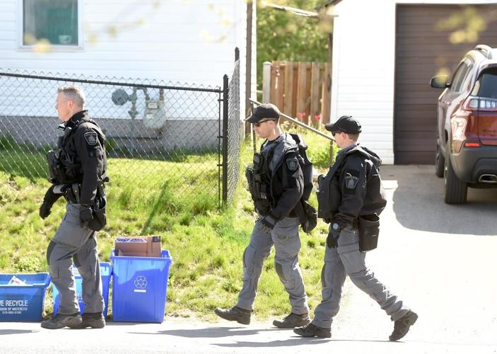 Heavy police presence in Cambridge after house fire on Alison Avenue