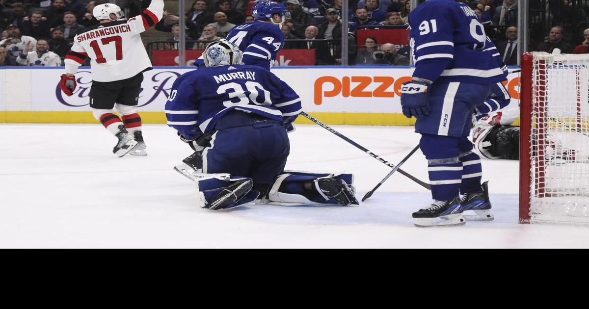 Devils beat Leafs in overtime for 11th straight win