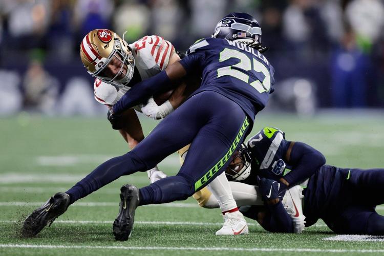 49ers star RB Christian McCaffrey injured in playoff game against Seahawks