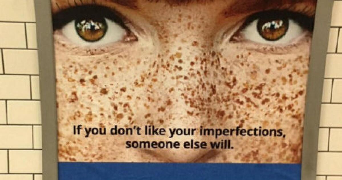 Red-faced match.com pulls subway ads that critique freckles
