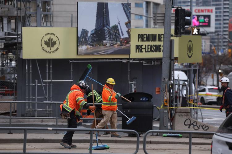 Glass falling from condo under construction on Spadina Ave