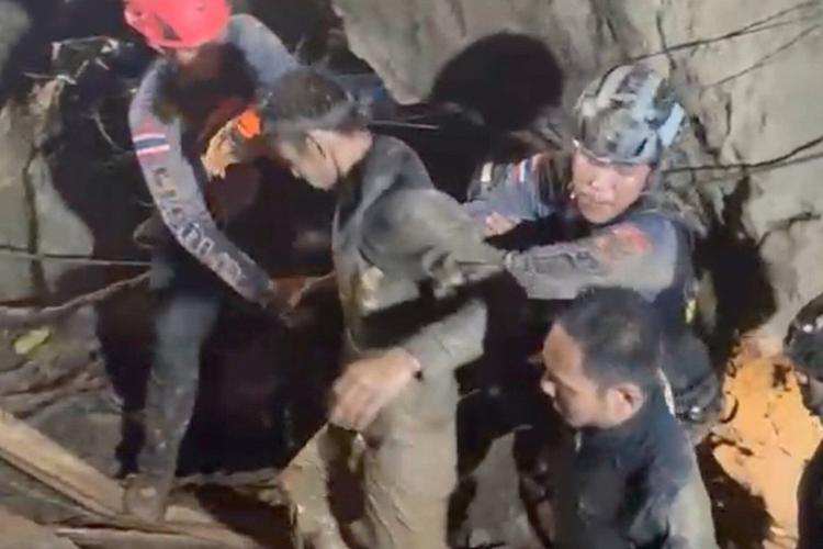 Rescuers search for alternative route to reach 2 missing in a flooded ...