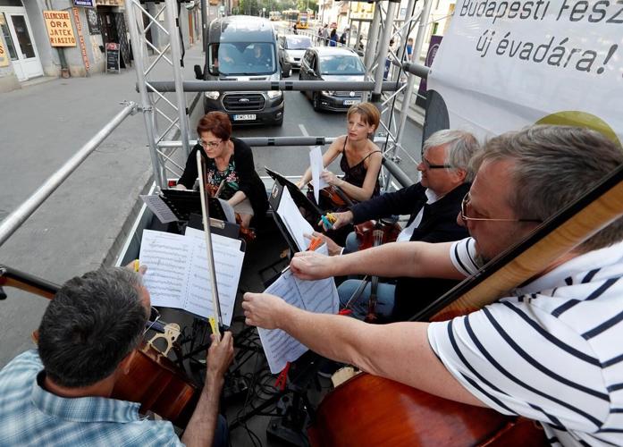 Budapest orchestra performs live concert from moving truck