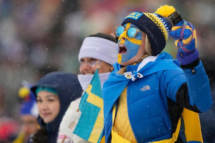 Fans from around the world fuel the Olympic spirit, in photos