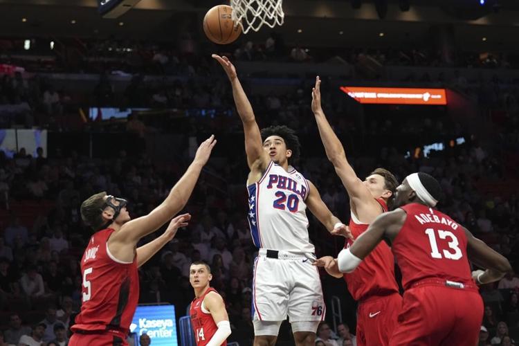 Heat shake off early deficit, roll past reeling 76ers 106-89