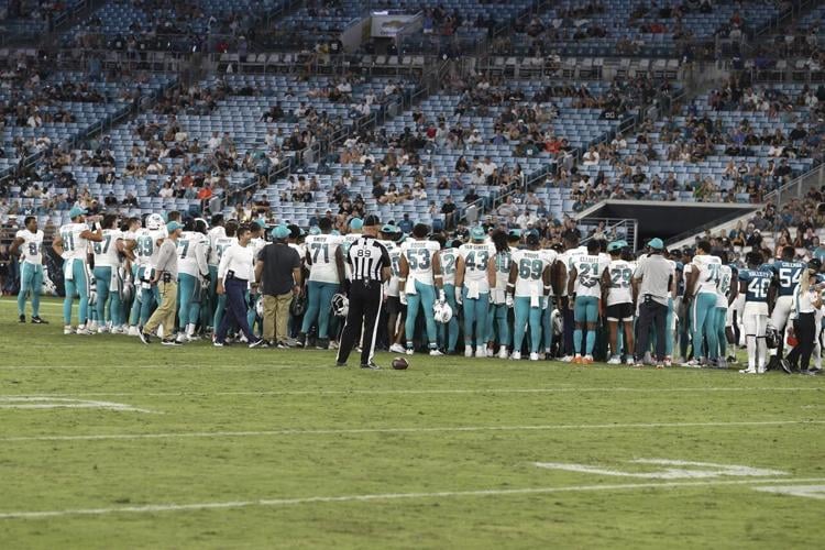 Daewood Davis of Dolphins carted off field after collision; preseason ...