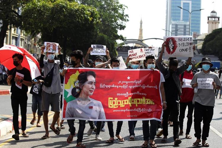 Myanmar junta imposes curfew, meeting bans as protests swell