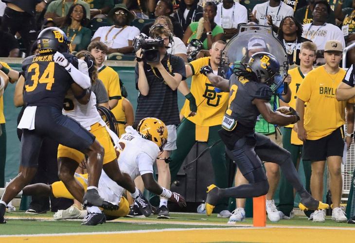 Defending Big 12 champion Arizona State wins league opener 27-24 at ...