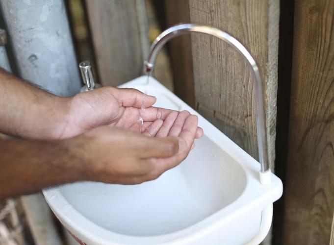 ‘We all benefit.’ Volunteers set up hand-washing stations across ...