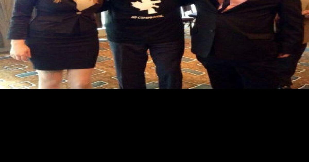 Justice Minister Peter MacKay poses in pro-gun T-shirt