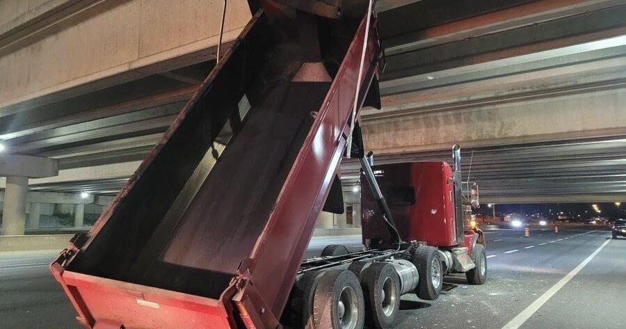Dump truck driver hits overpass on Ontario highway