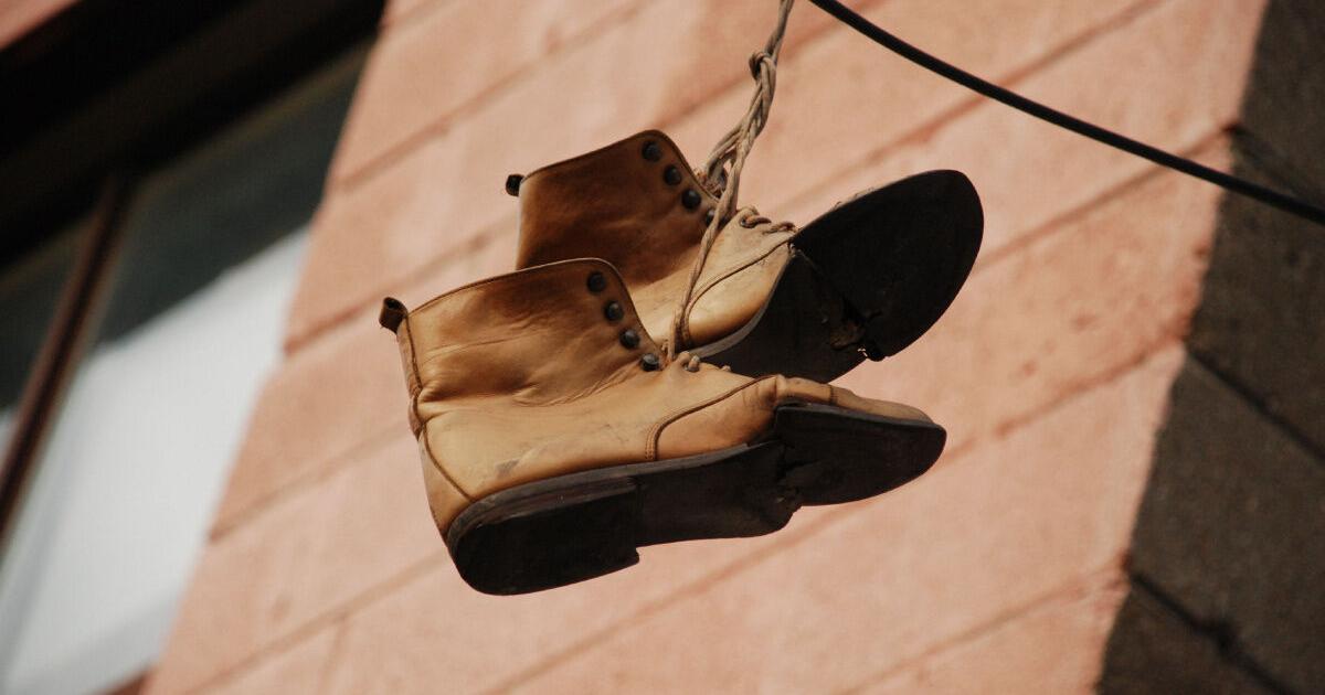 Shoes dangle from wires overhead all over Toronto. What does it mean?