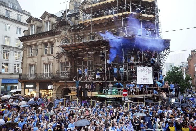 Manchester City celebrates winning treble of major trophies with open ...