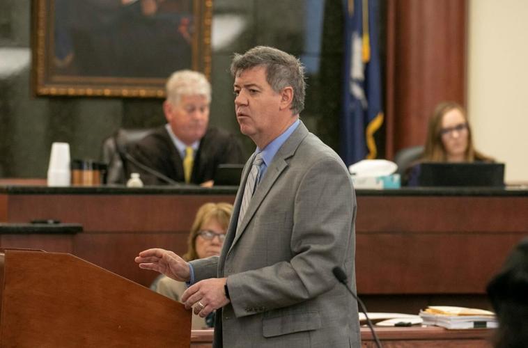 The Latest: Grisly and tender photos in dad’s murder case