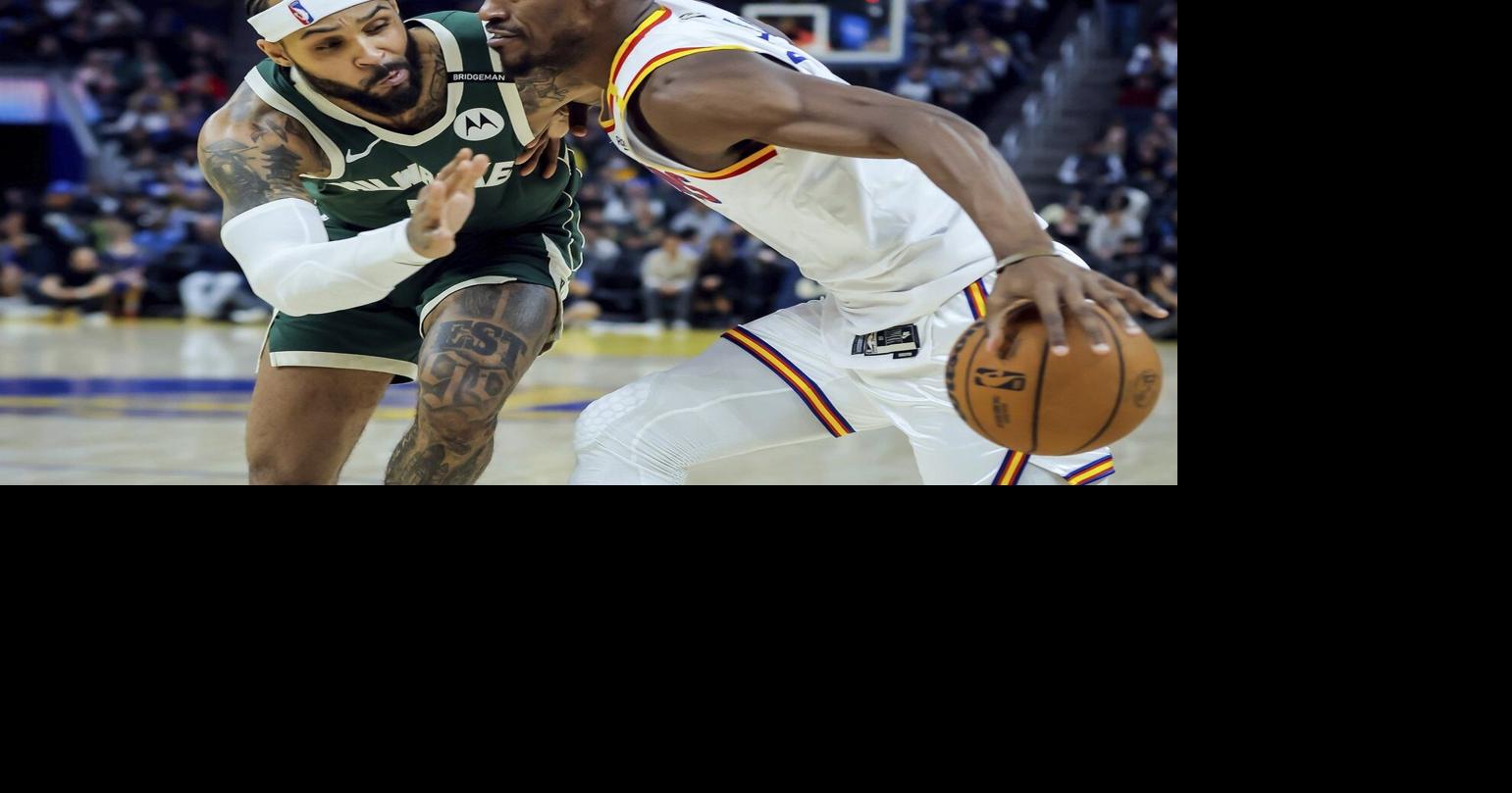 Butler scores 24 and Warriors win without Curry, 104-93 over Bucks