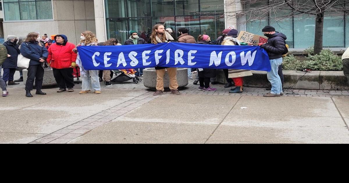 Protesters gather at Toronto police station