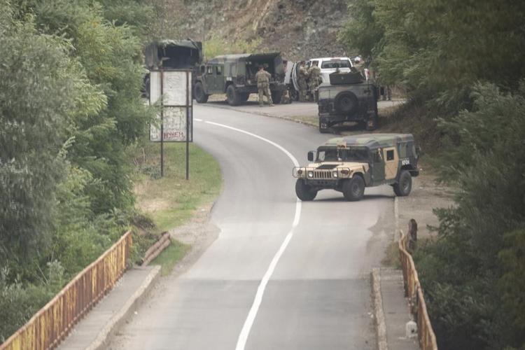 Kosovar police surround a village after Serb gunmen storm a monastery ...