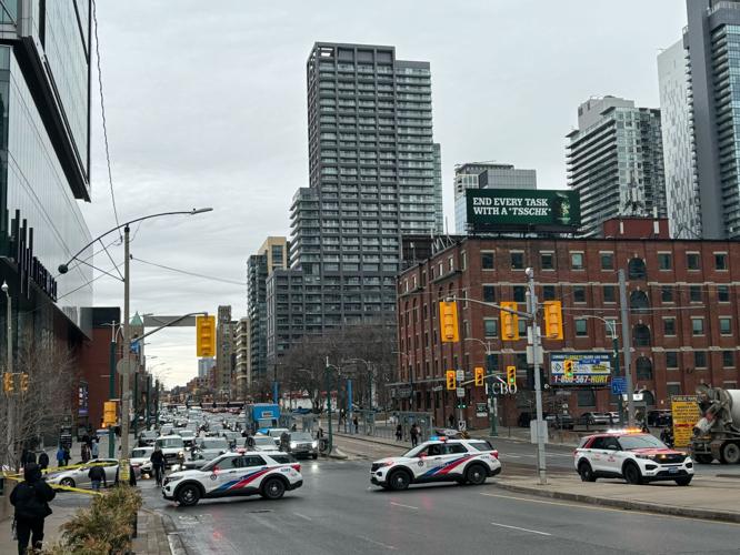 Glass falling from condo under construction on Spadina Ave