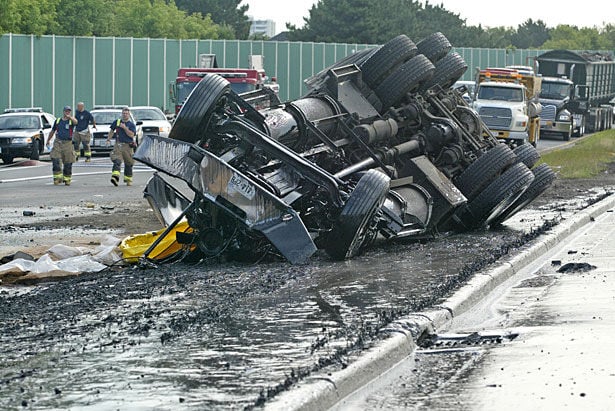 Truck spill of hot tar scalds 401