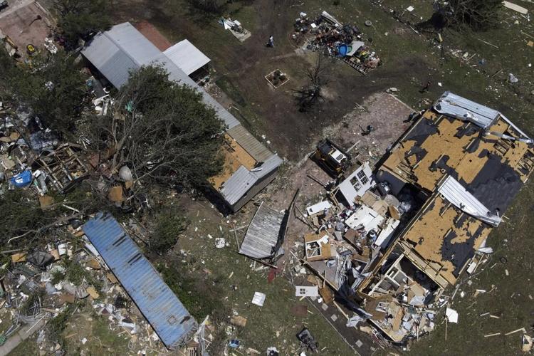 In a north Texas county, dazed residents sift through homes mangled by a tornado