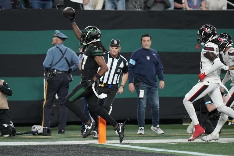 Garrett Wilson makes eye-popping TD catch, Jets beat Texans 21-13 to ...