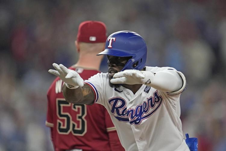 Rangers slugger Adolis García gets postseason-record 22nd RBI with ...