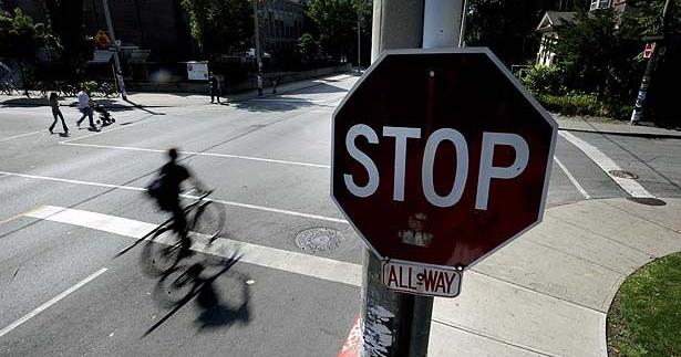 Do cyclists need to stop at a stop sign?