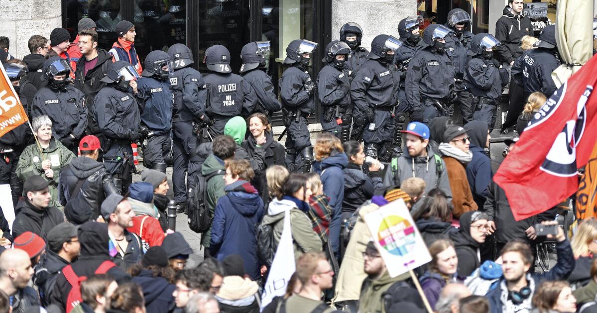 Protests, divisions erupt at German nationalist convention