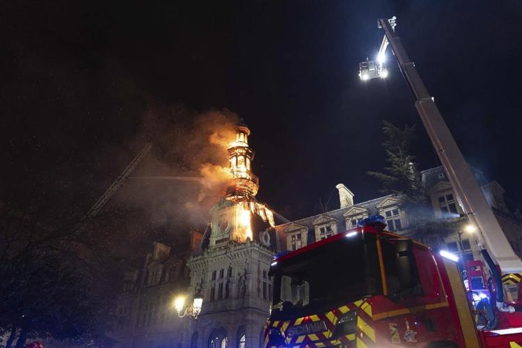 Fire damages a 19th century district town hall in Paris, leaving the bell tower at risk of collapse
