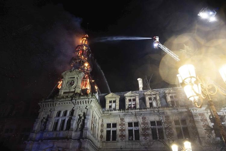 Fire damages a 19th century district town hall in Paris, leaving the bell tower at risk of collapse