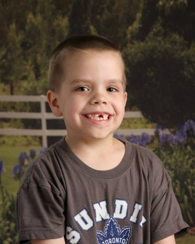 One boy dead, siblings and mother in hospital following townhouse fire ...