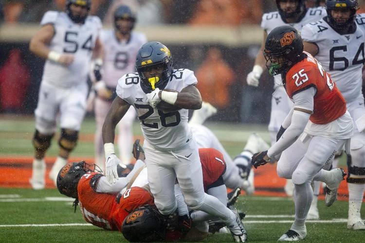 Anderson’s 2 long TD runs help W. Virginia top Oklahoma St.