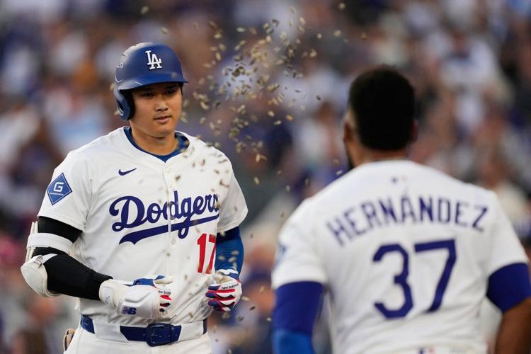 Ohtani hits 2 homers for Dodgers in playoff opener against Reds