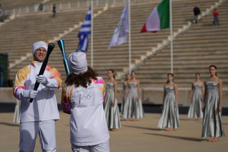 Olympic flame for Milan Cortina Winter Games handed to Italian ...